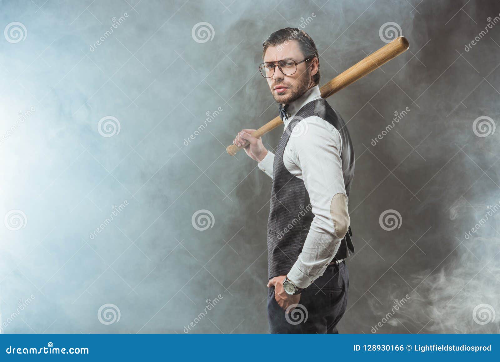Serious Stylish Man Holding Baseball Bat and Looking at Camera while ...