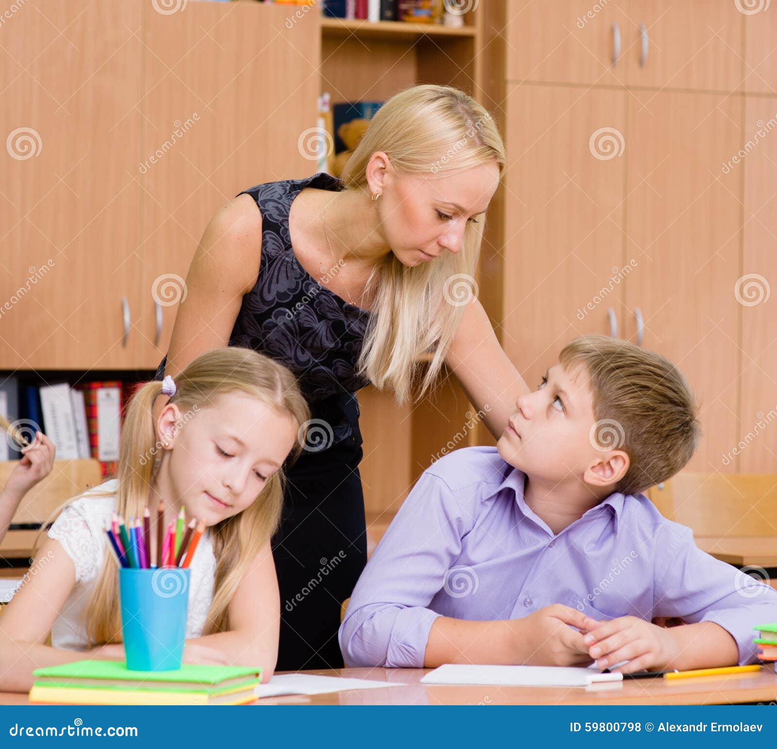 Serious Teacher Talking with a Student during the Exam Stock Photo ...