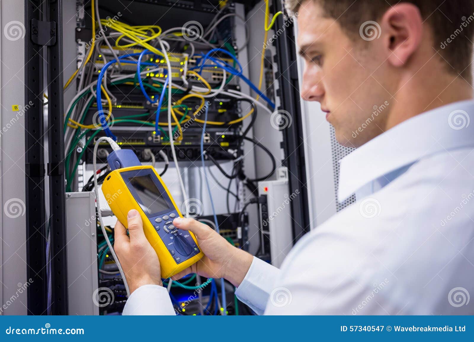 Serious Technician Using Digital Cable Analyzer on Server Stock Image ...