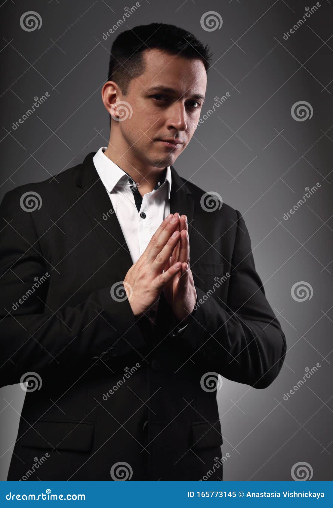 Black Man In Suit Praying