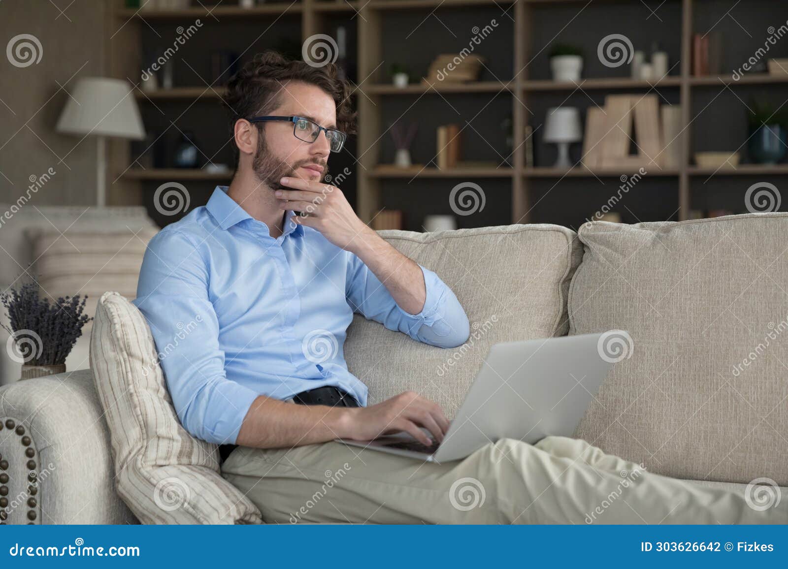 Serious Man Sit on Sofa Working Online Using Laptop Stock Photo - Image ...