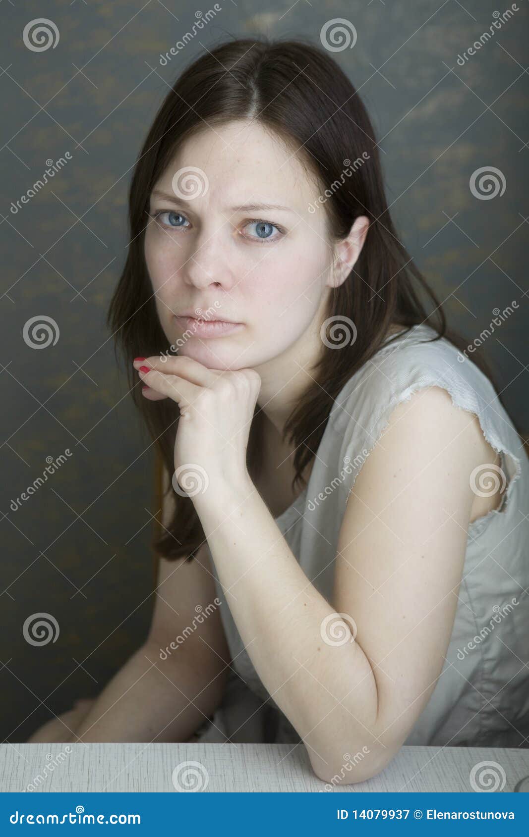 Serious Woman with Blue Eyes Sitting at Table Stock Image - Image of ...