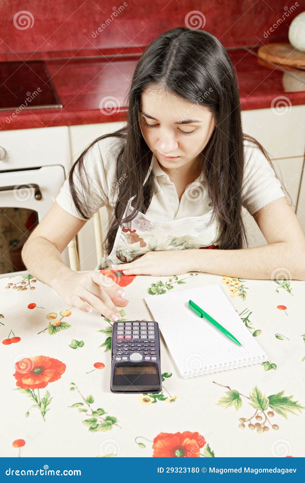 Serious Woman Making Calculations Stock Photo - Image of indoors ...