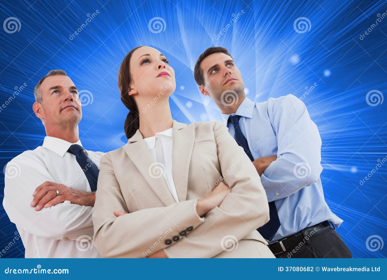 Serious Work Team Posing Together Looking Away Stock Photo - Image of ...
