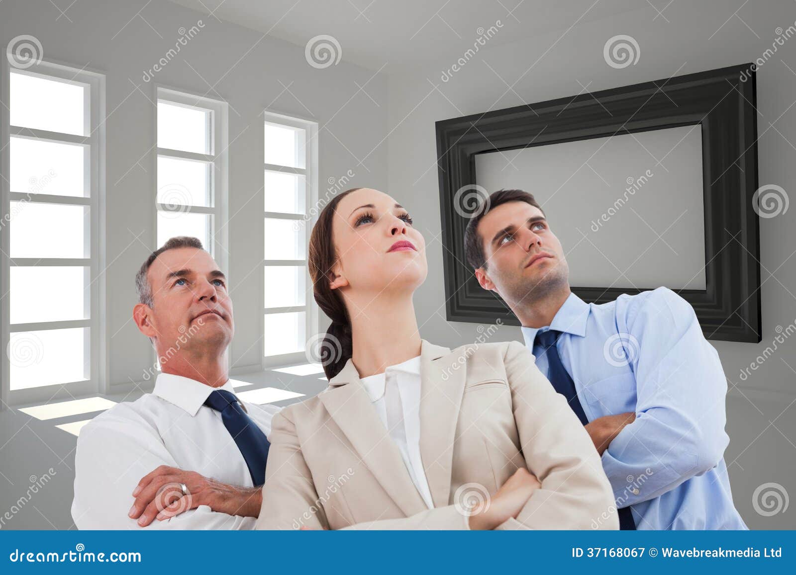 Serious Work Team Posing Together Looking Away Stock Image - Image of ...