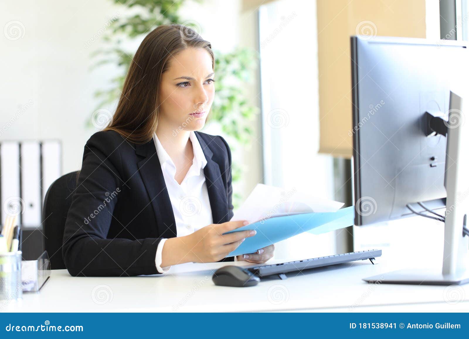Serious Worker Checking Online Information at Office Stock Image ...