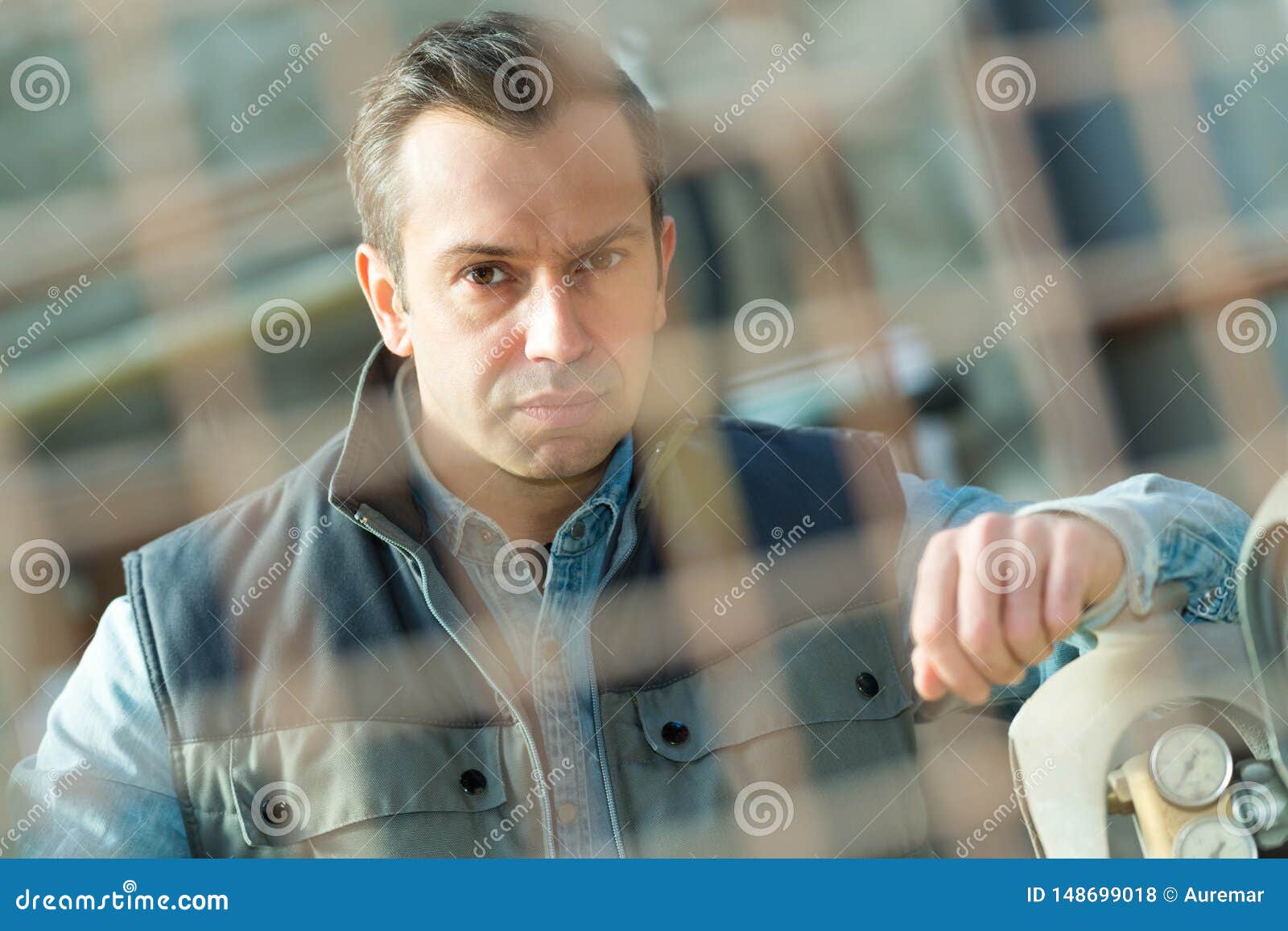 Serious Worker with Yellow Helmet and Work Suit Stock Photo - Image of ...