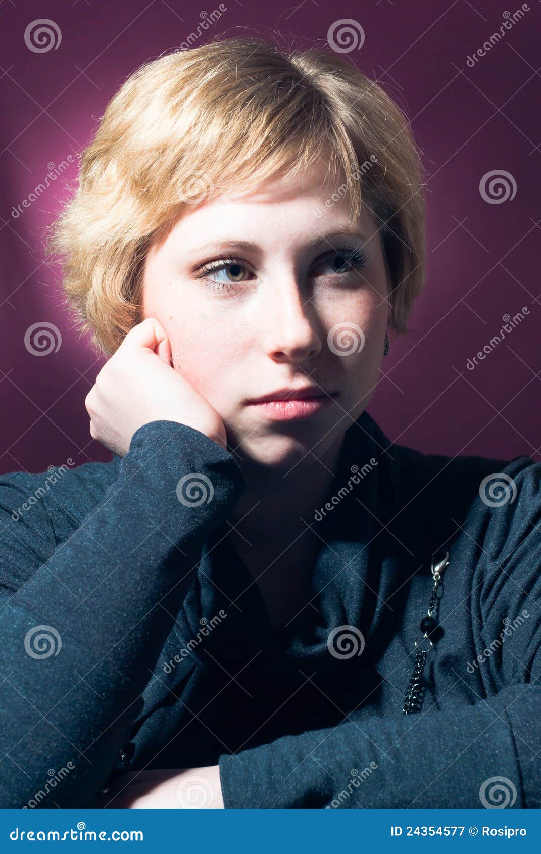 Serious young blond woman stock image. Image of eyes - 24354577