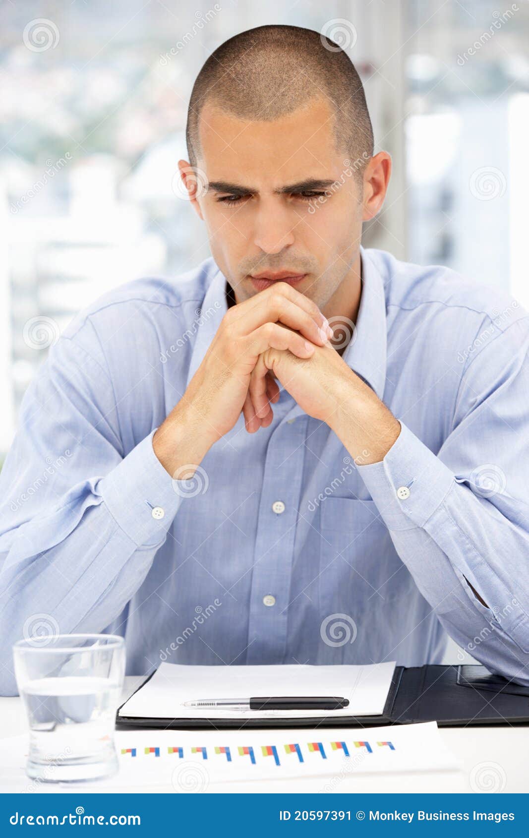 Serious young businessman stock image. Image of suit - 20597391