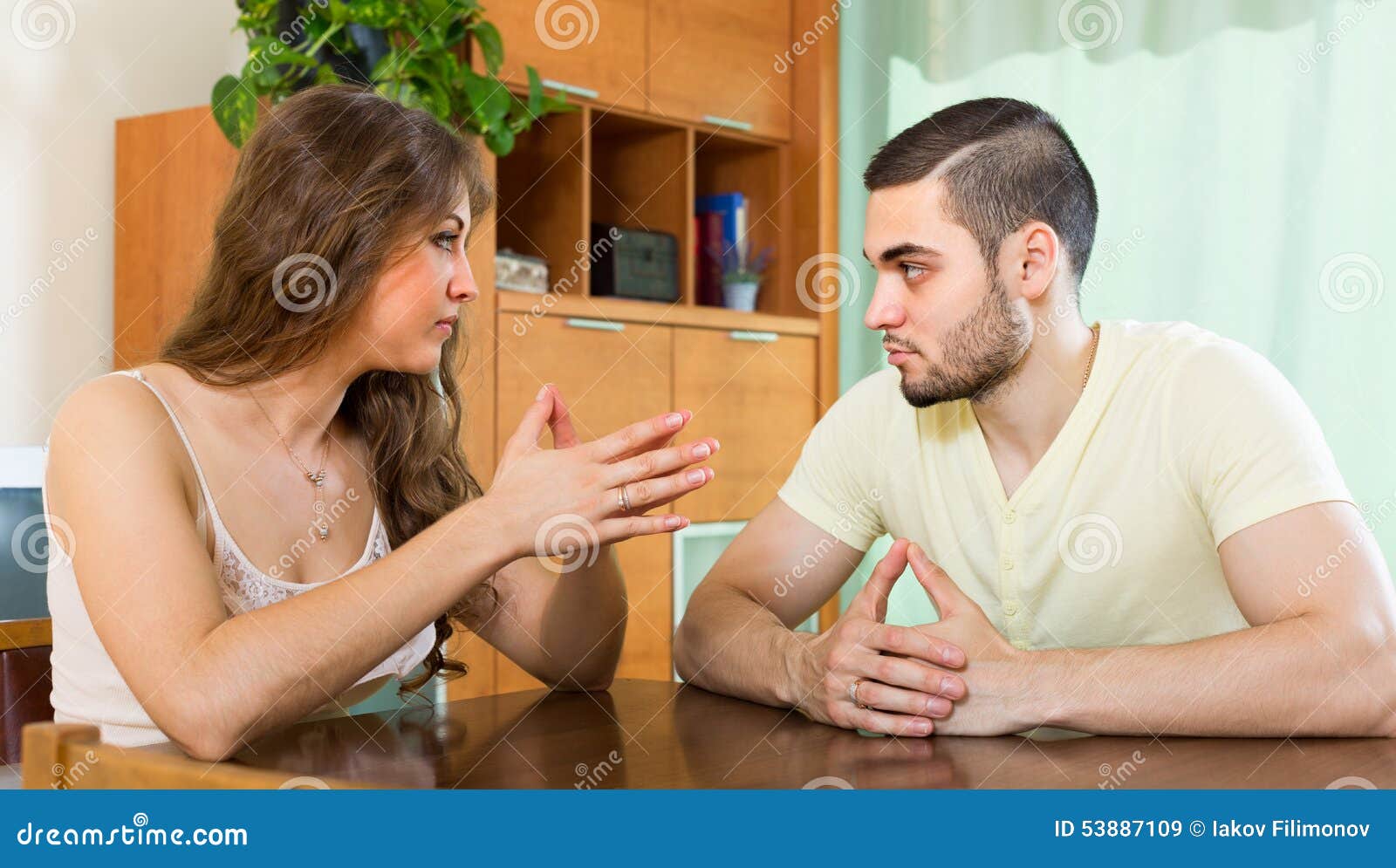 Serious Young Couple Talking at Home Stock Image - Image of couple ...