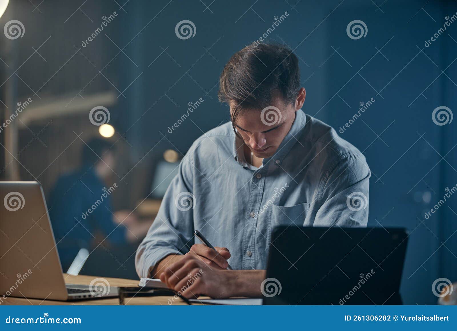 Serious Young Entrepreneur Writing Something Down in His Weekly . Stock ...