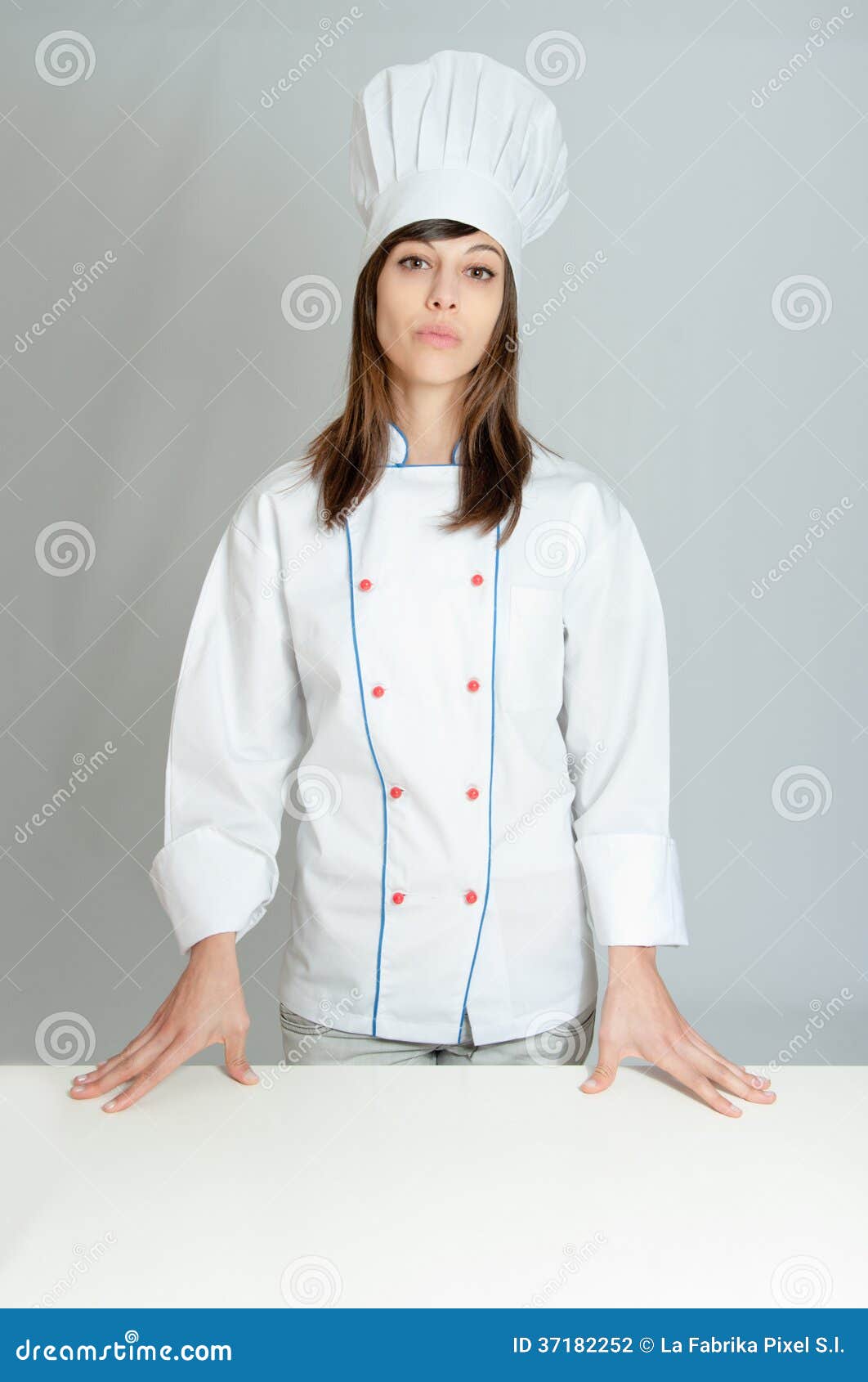 Serious young female chef stock photo. Image of toque - 37182252