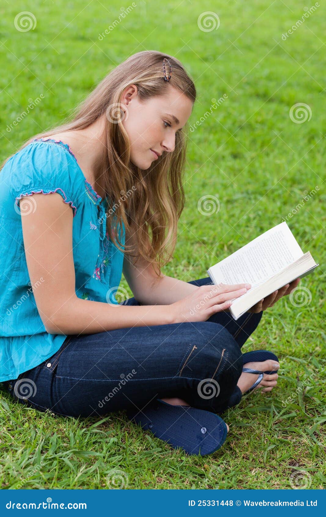 Serious Young Girl Reading a Book Stock Photo - Image of garden, grass ...