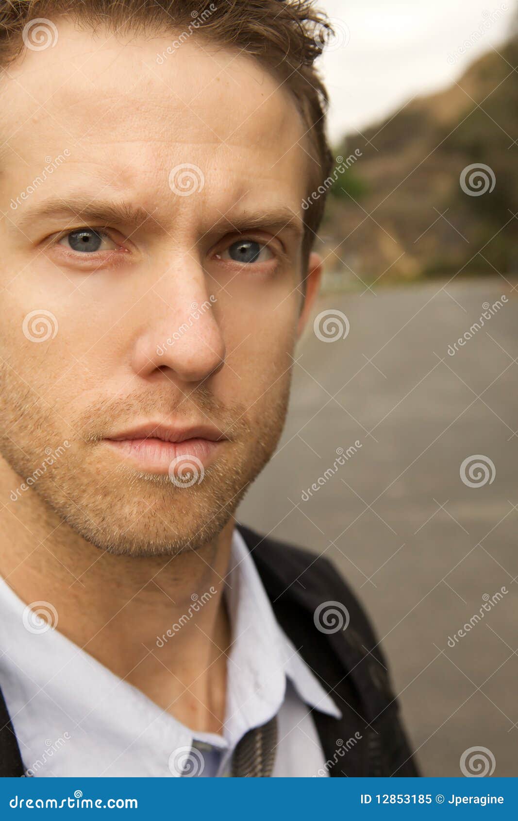 A serious young man stock image. Image of blue, corporate - 12853185