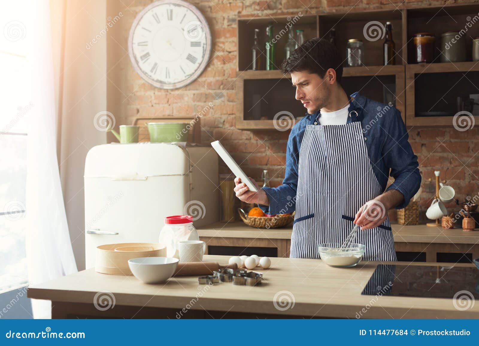 Serious Young Man Baking in Loft Kitchen Stock Photo - Image of cook ...