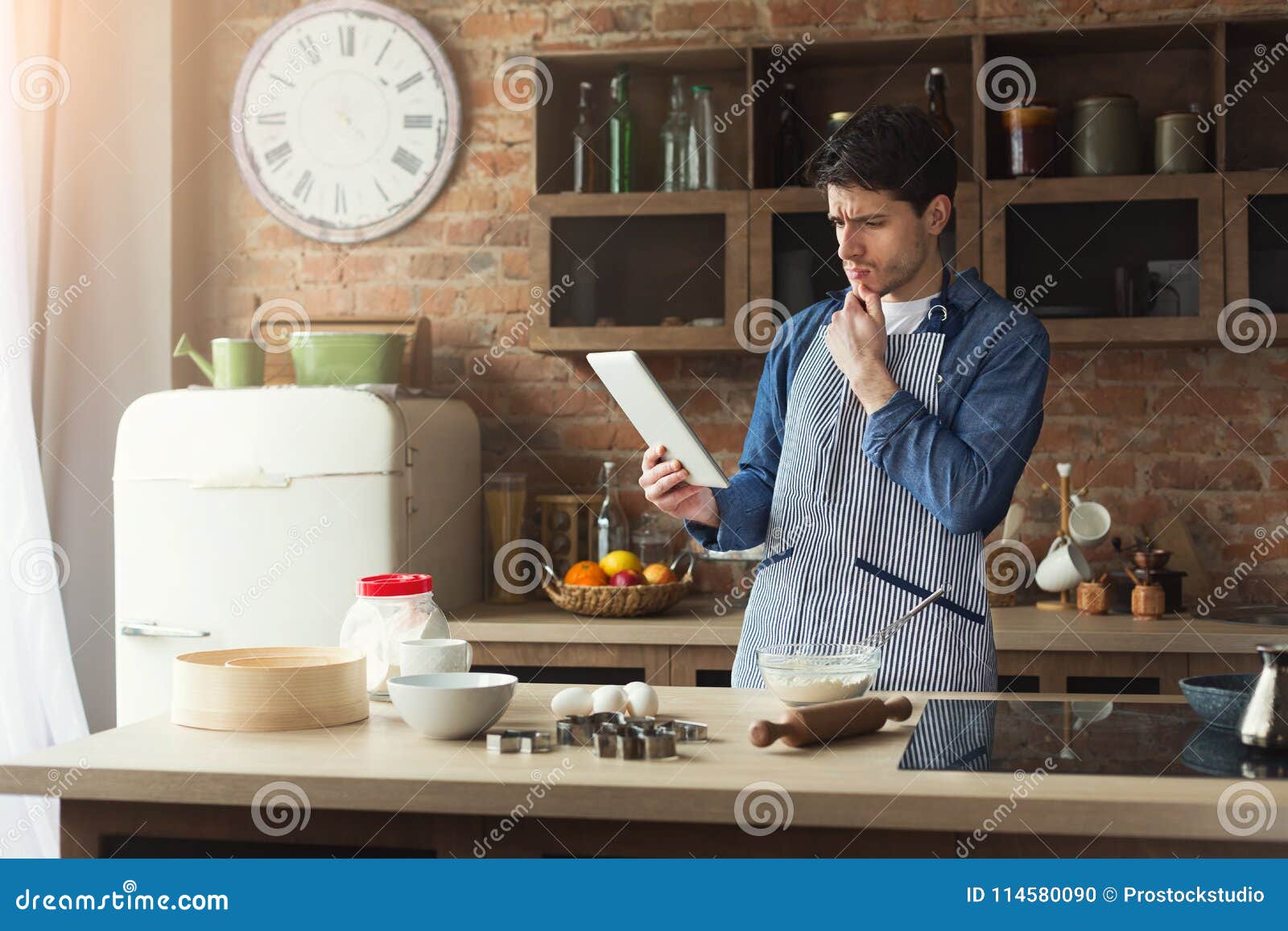 Serious Young Man Baking in Loft Kitchen Stock Photo - Image of cookies ...