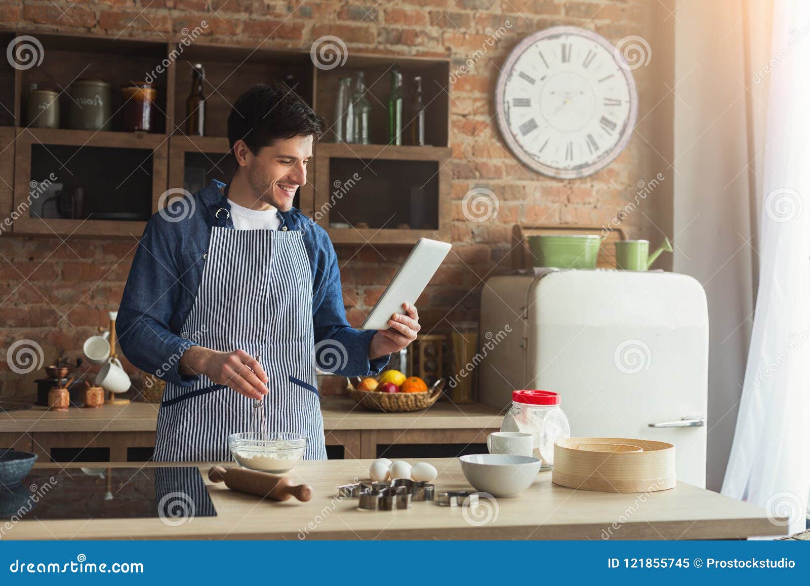 Serious Young Man Baking in Loft Kitchen Stock Image - Image of baking ...