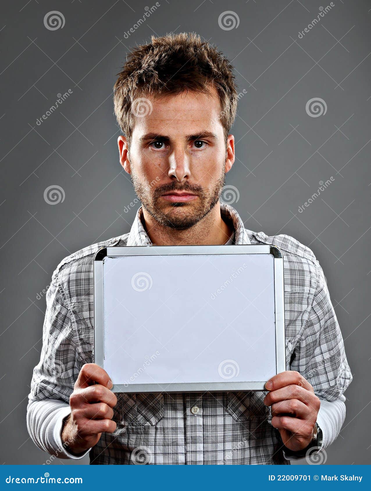 Serious Young Man Holding Sign Stock Image - Image of eyes, space: 22009701