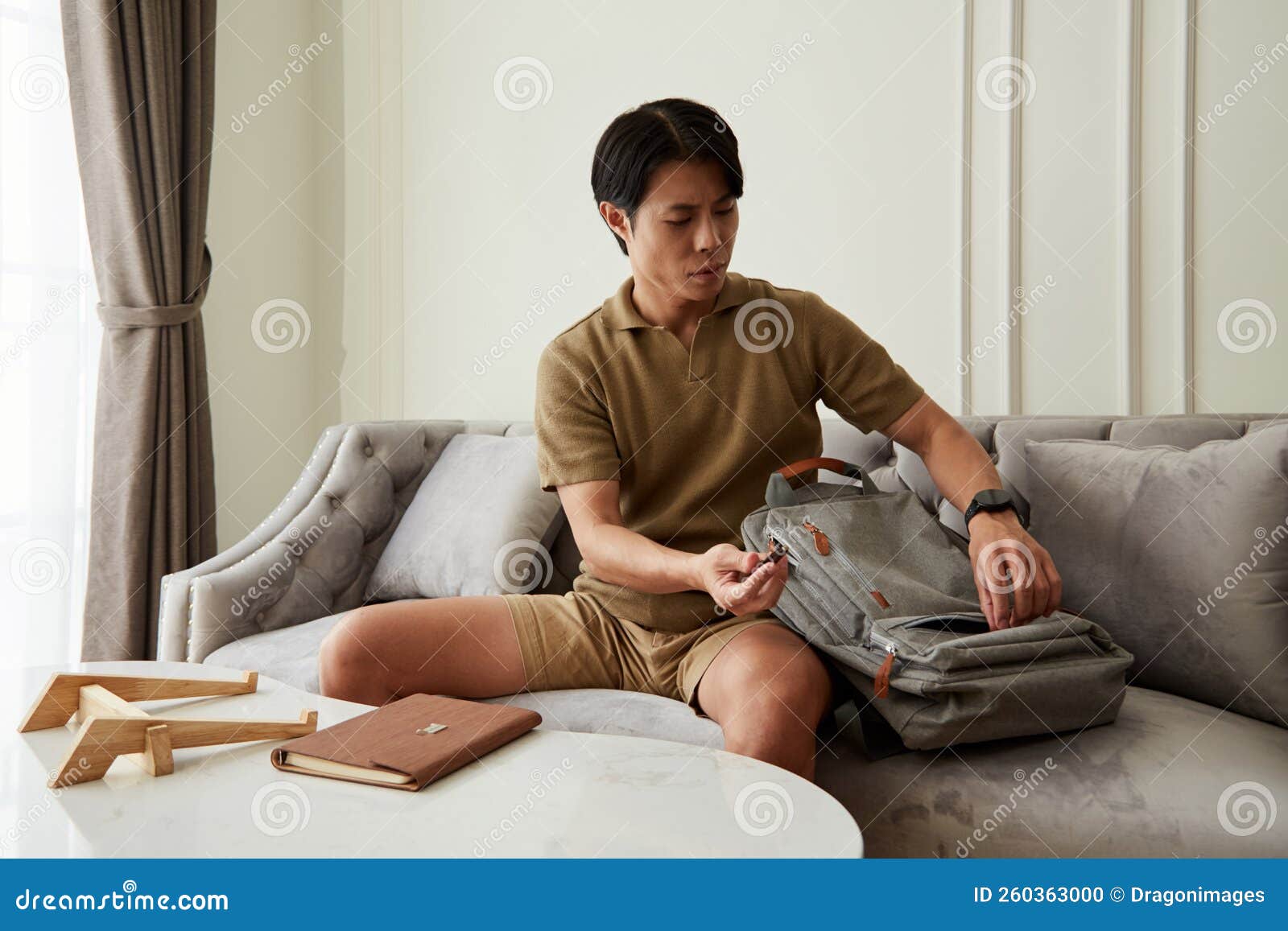 Man Packing Backpack stock photo. Image of student, opening - 260363000