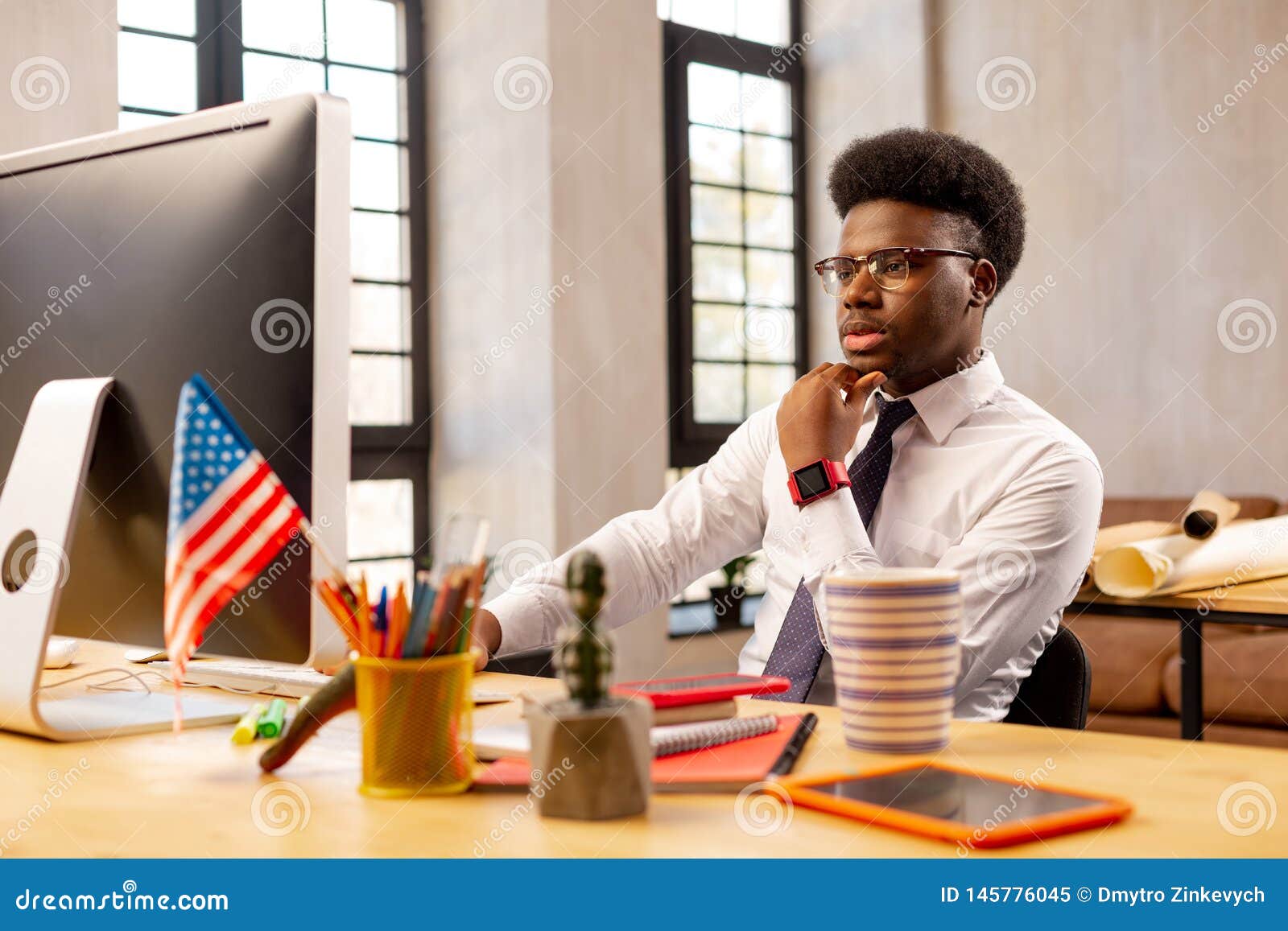Serious Young Man Working in the Office Stock Image - Image of serious ...