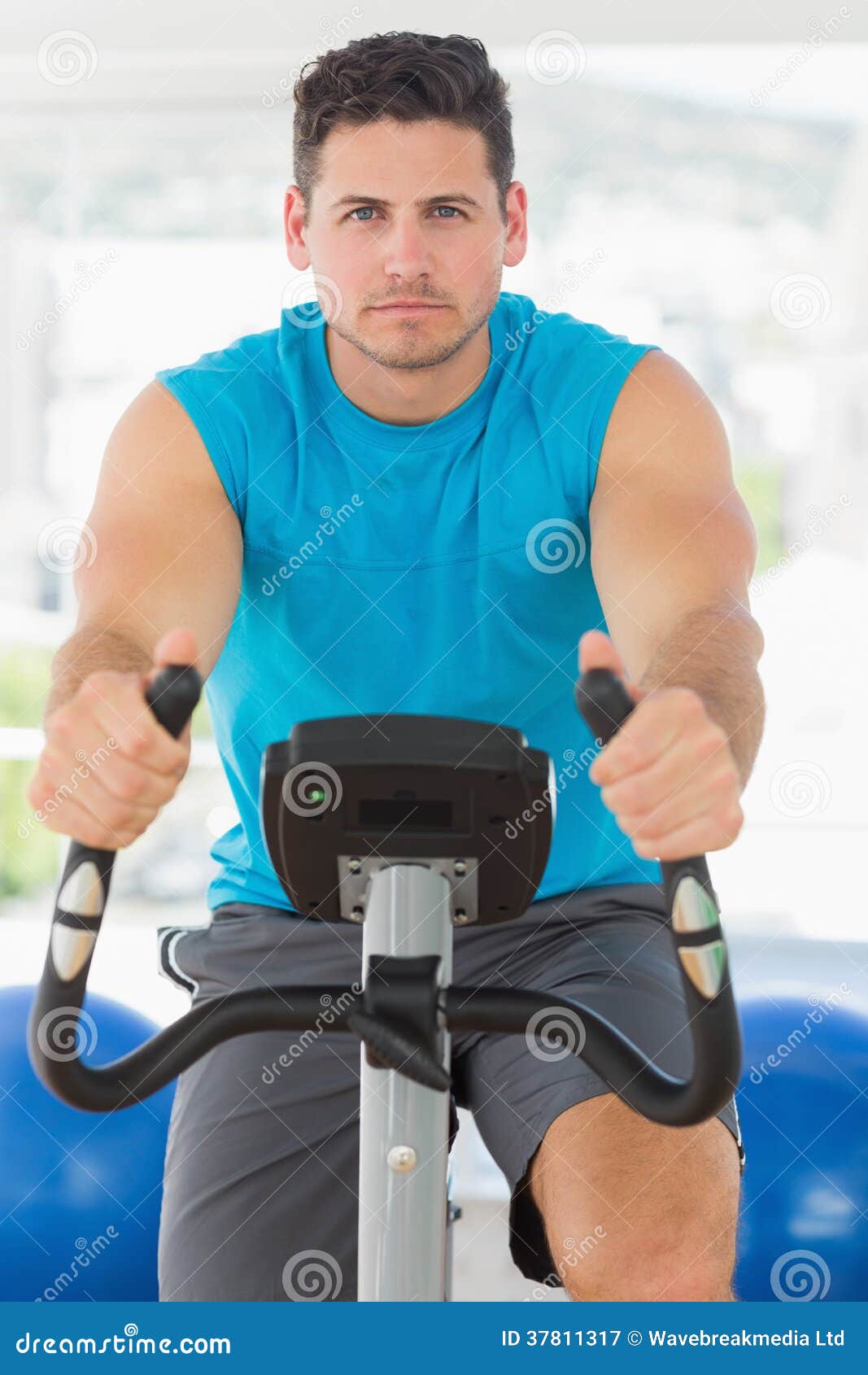 Serious Young Man Working Out at Spinning Class Stock Image - Image of ...