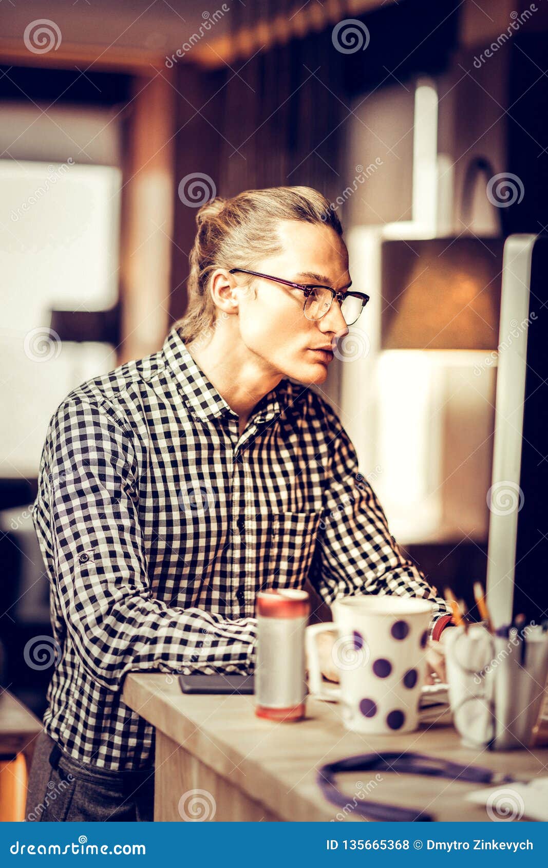 Serious Young Man Working at Project Alone Stock Photo - Image of ...