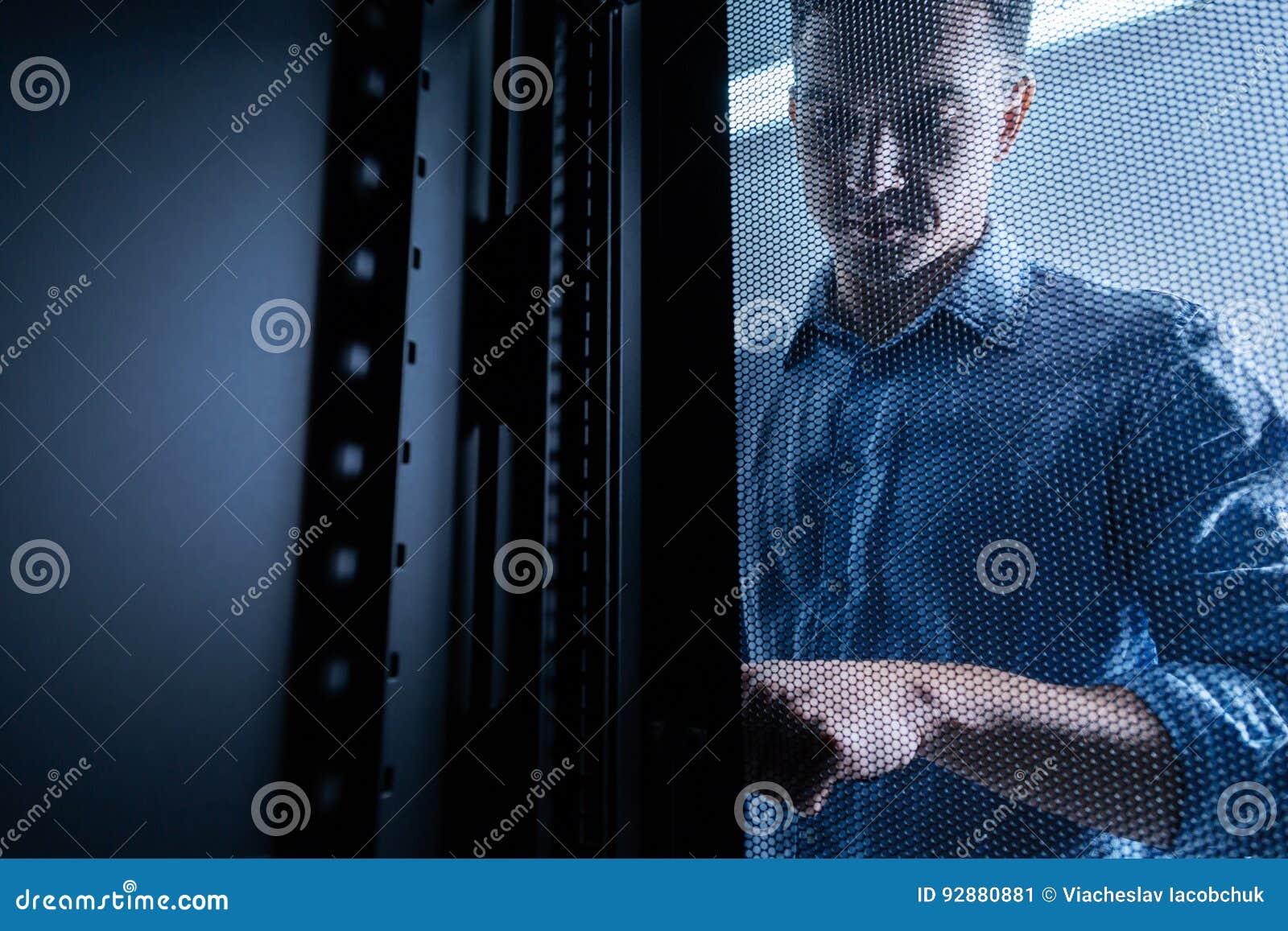 Serious Young Man Working in the Server Room Stock Image - Image of ...