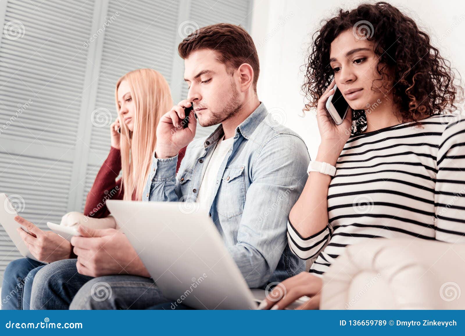Serious Young People Making Calls Stock Image - Image of device ...