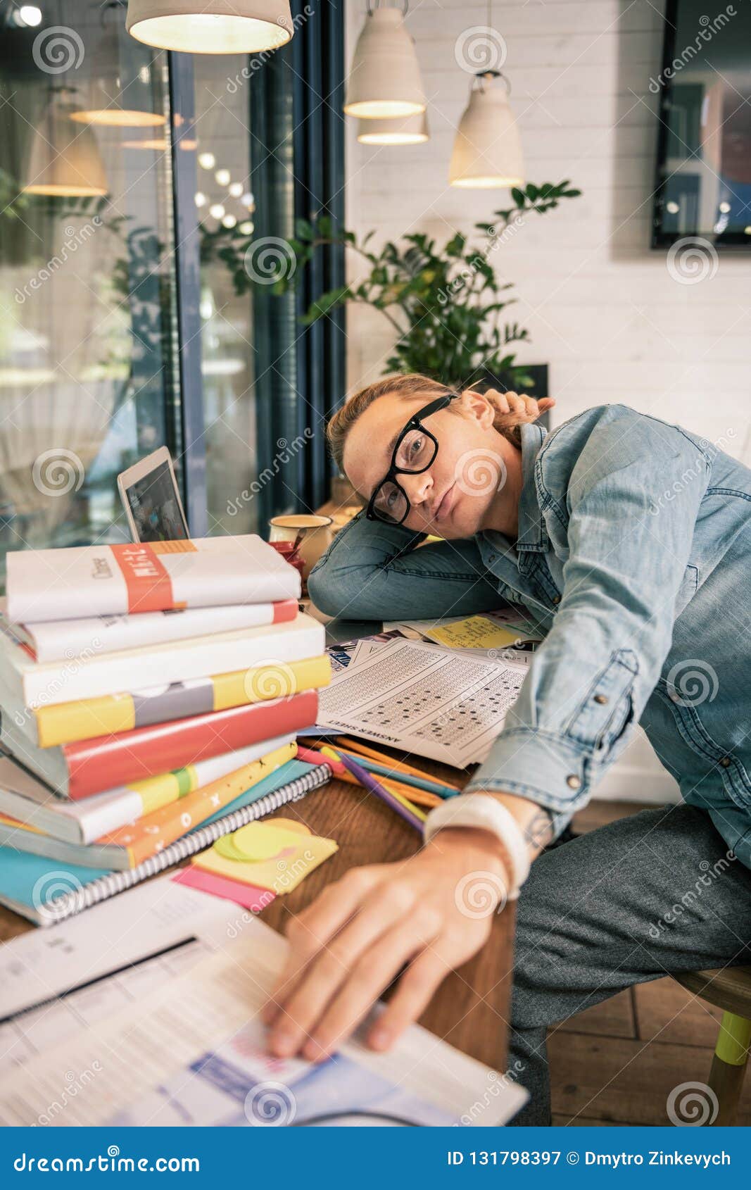 Serious Young Student Being Surrounded by Books Stock Image - Image of ...