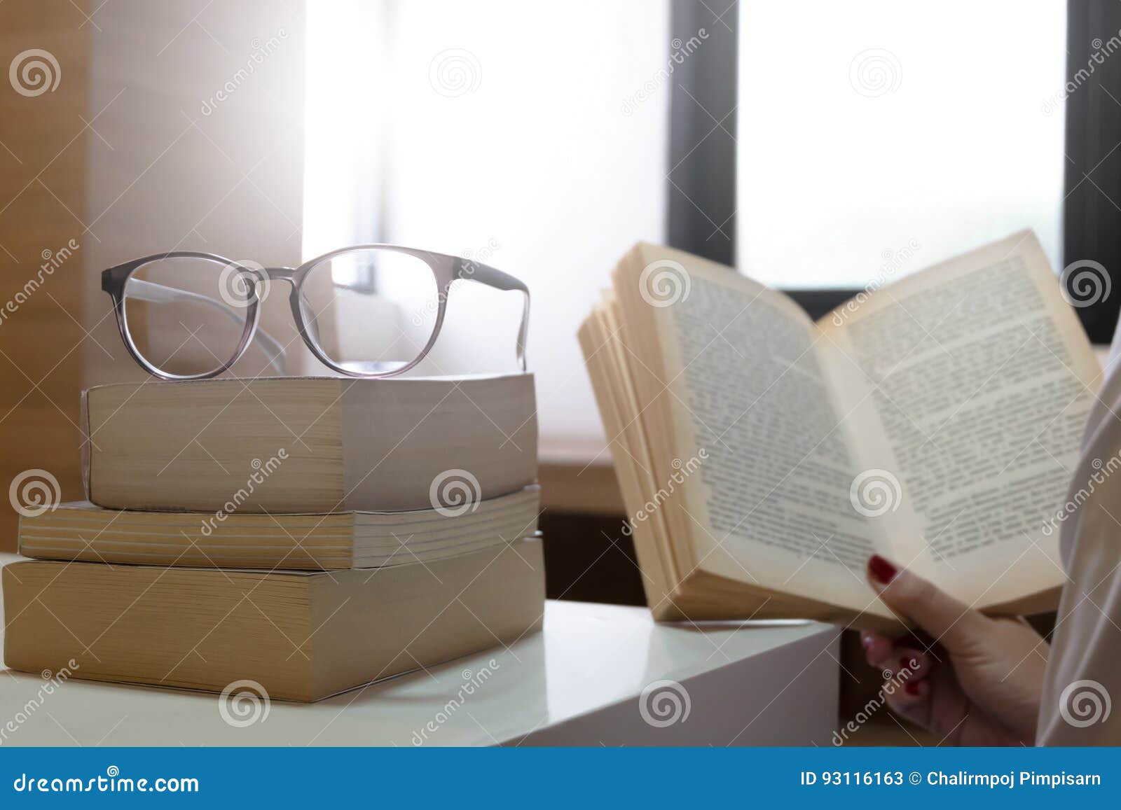 Serious Young Student Reading a Book in a Library Selected Focus Stock ...