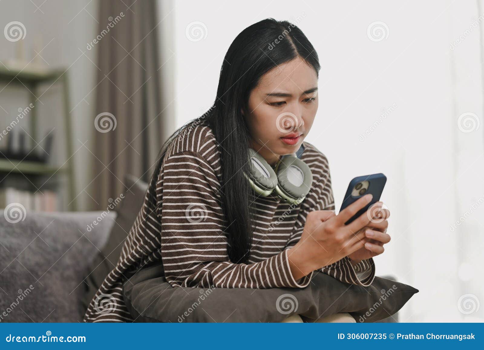 Serious Young Woman Getting Problems with Mobile Phone, Chatting in ...