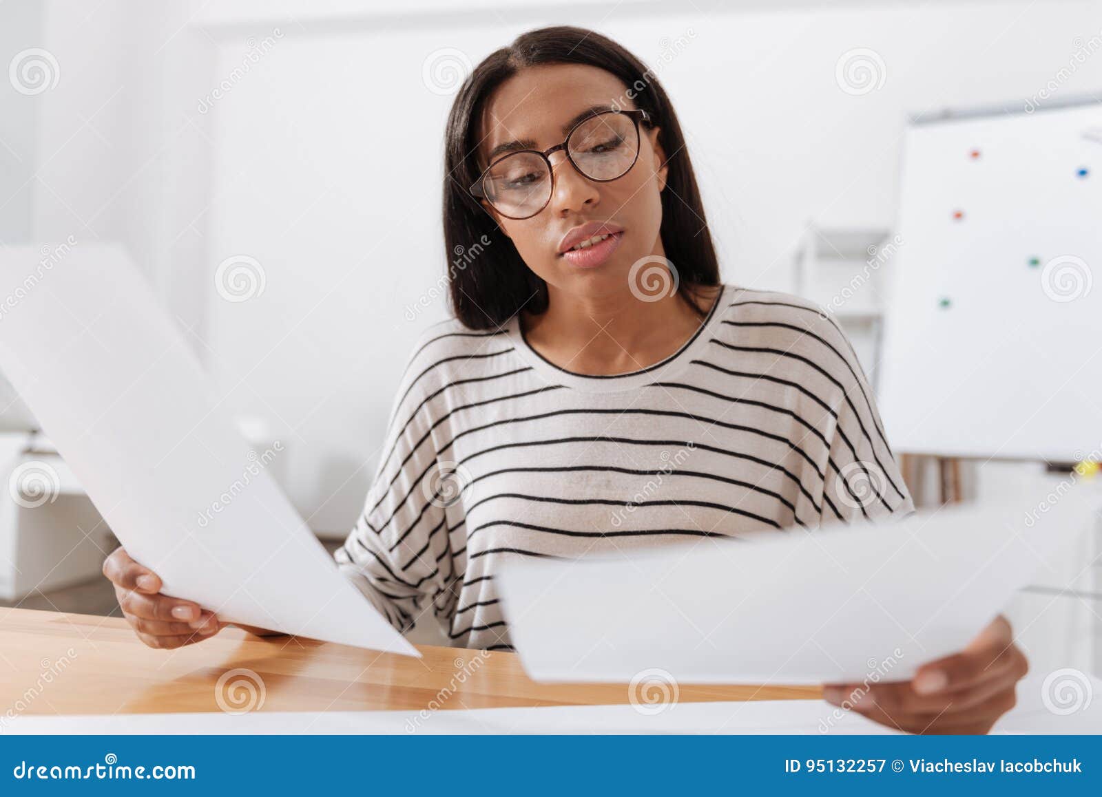 Serious Young Woman Looking at the Documents Stock Image - Image of ...
