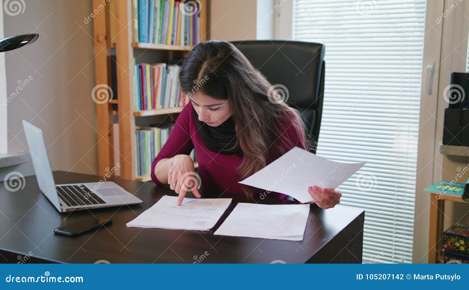 Serious Young Woman Looking on Documents. Stock Photo - Image of modern ...