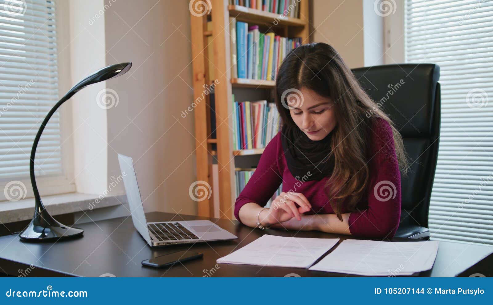 Serious Young Woman Looking on Documents. Stock Photo - Image of laptop ...