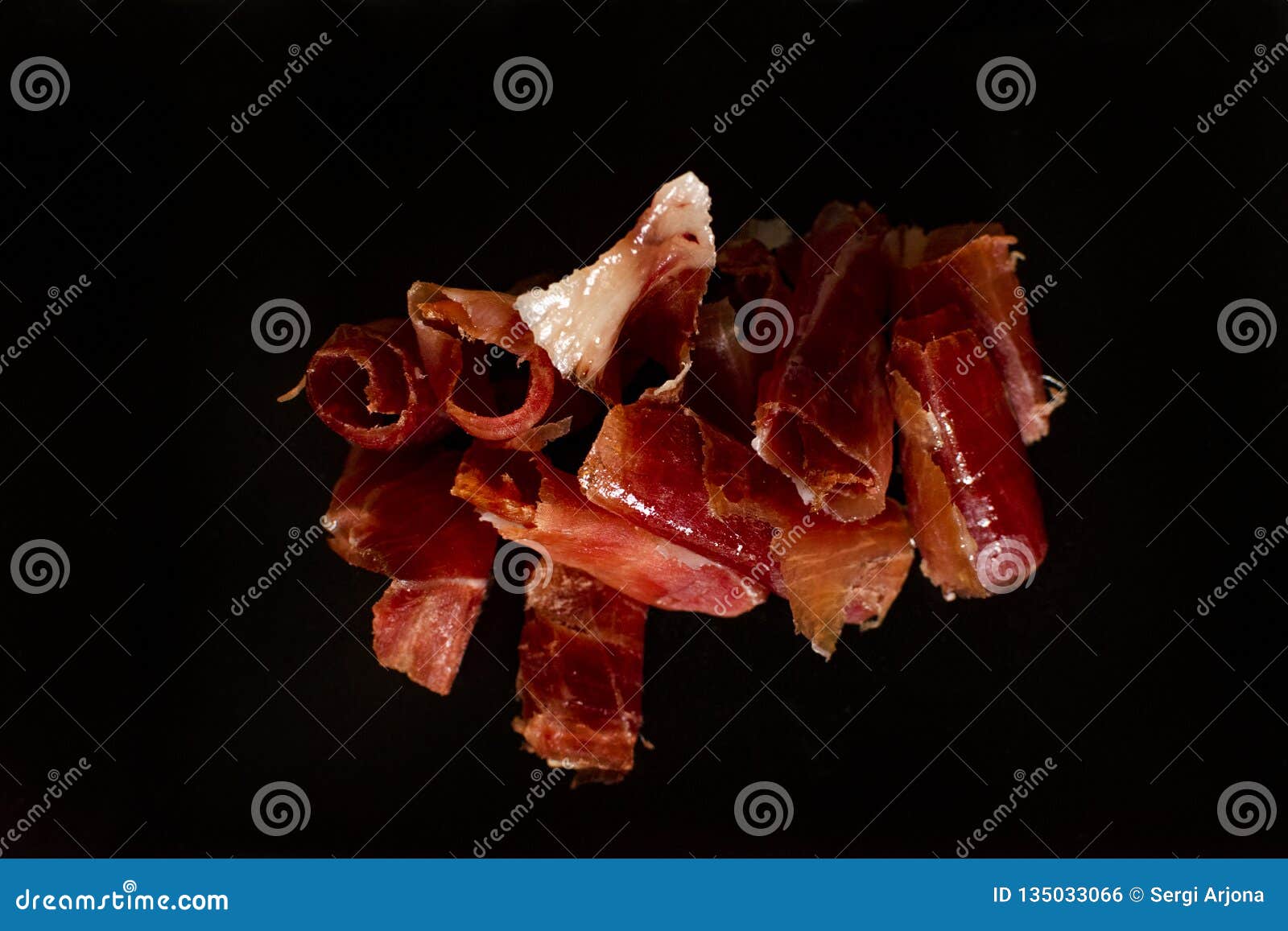 Serrano Ham Cut on Black Background Stock Photo - Image of gastronomy ...