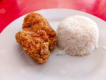 Serve Eating Fried Chicken with White Rice on a White Plate Stock Photo ...