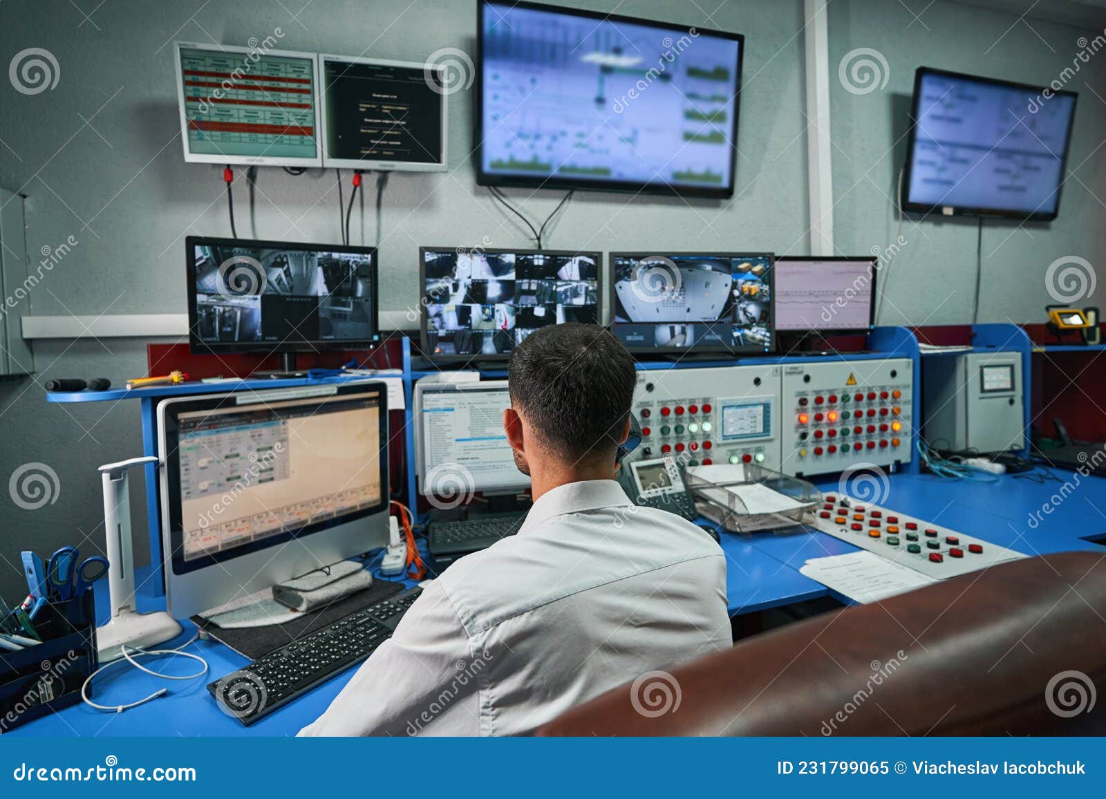 Server Administrator Looking after Data Center Rooms through Monitors ...