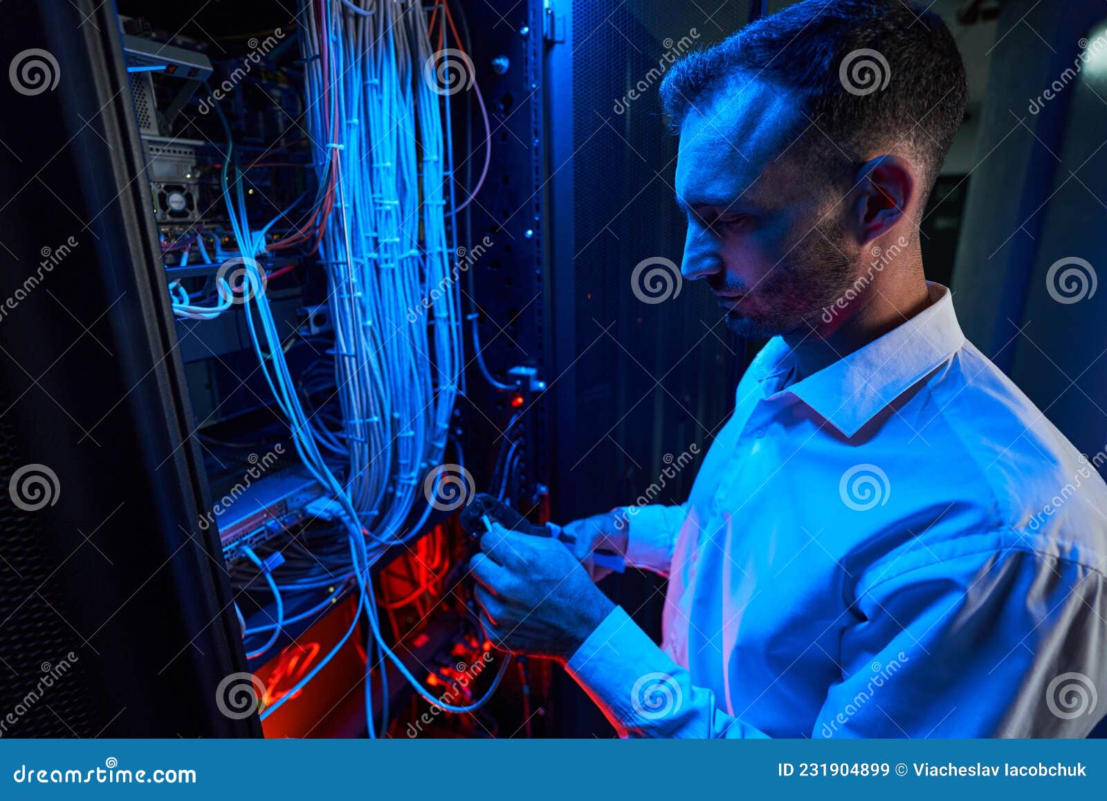 Server Administrator Putting Twisted Pair into Crimping Tool Stock ...