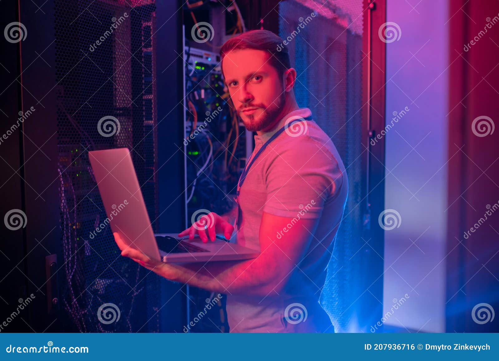 Man with Laptop Ensuring the Server Stock Photo - Image of service ...