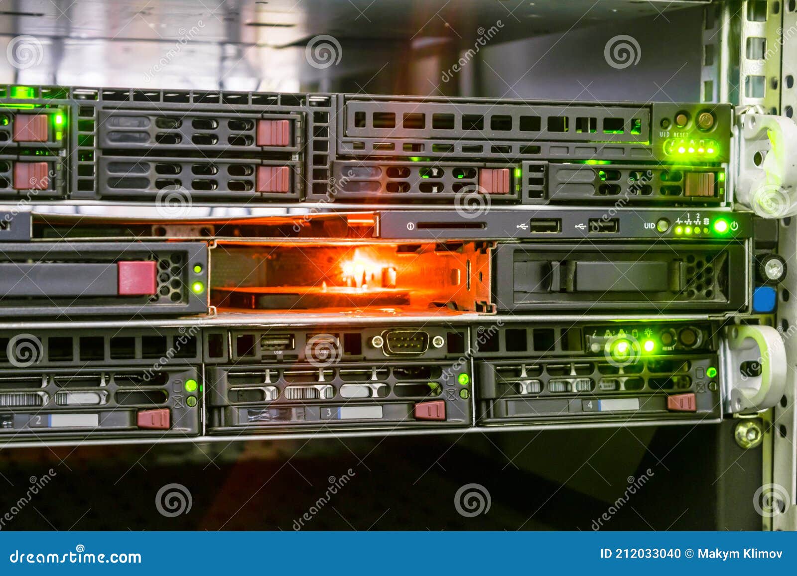 A Server With Multiple Hard Drives Works In A Data Center Rack. A Place ...