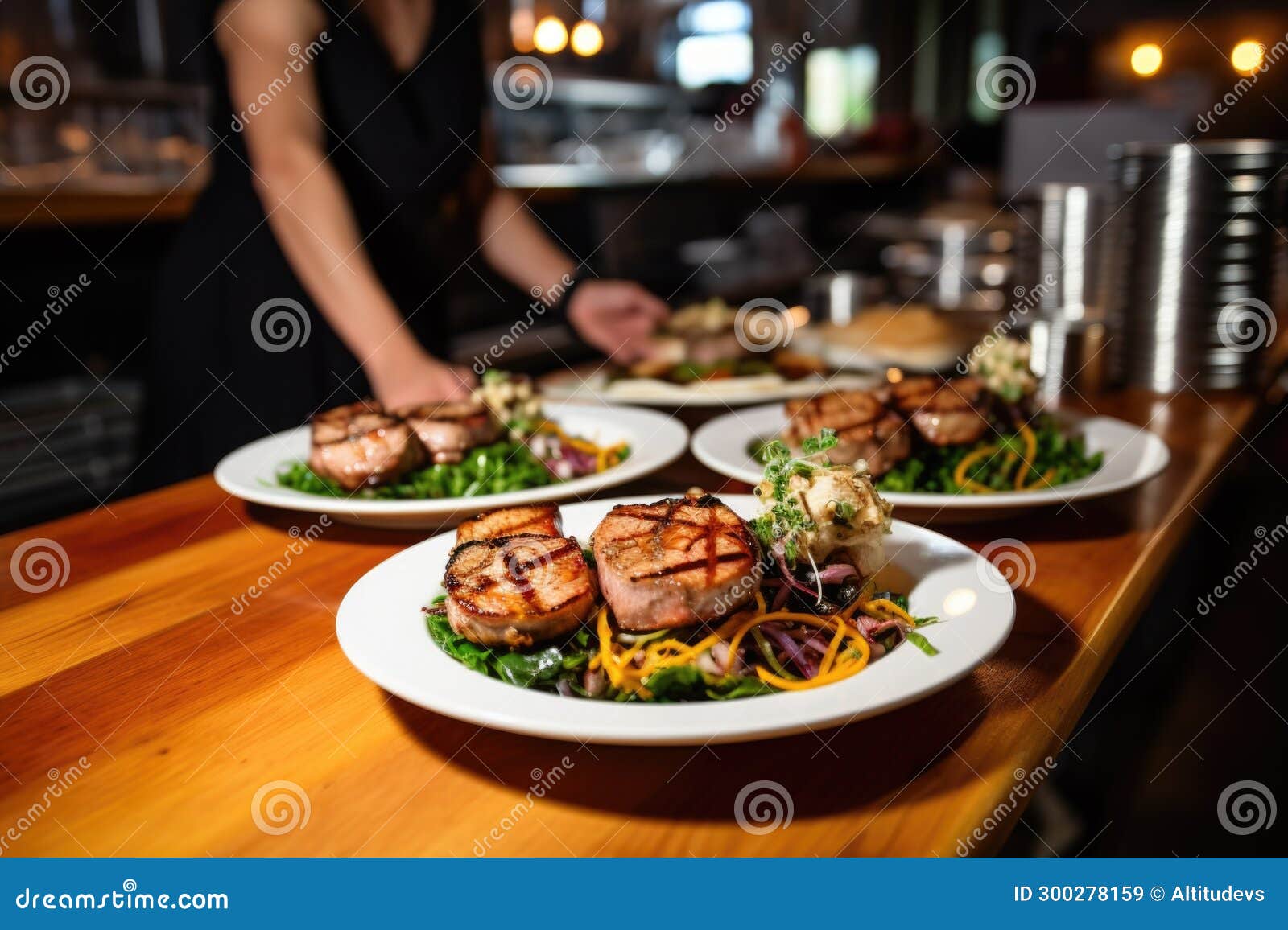 Server Placing Grilled Pork Chops on Diners Plates Stock Image - Image ...