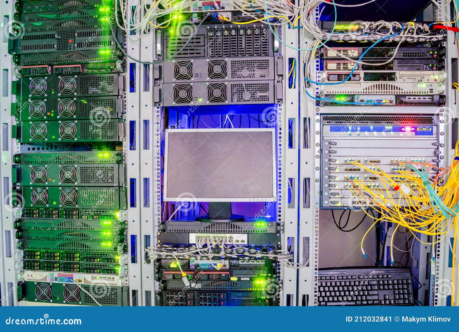 The Server Rack is in a Modern Data Center. the Monitor is Installed in ...