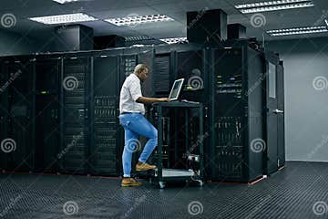 Server Room, Database and Information Technology with an Engineer Man ...