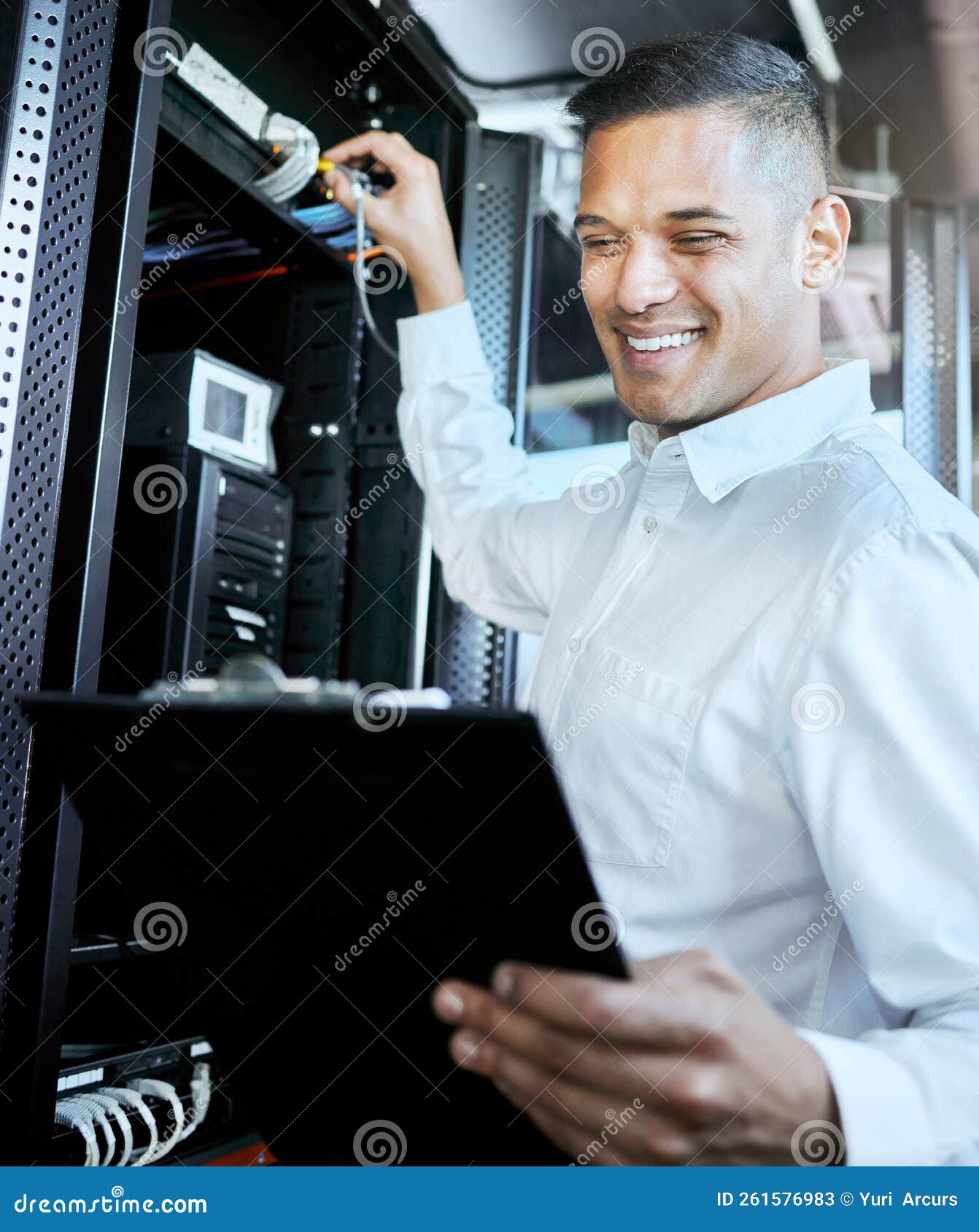 Server Room, it Support and Database with a Man Programmer Working on a Mainframe in a Data ...