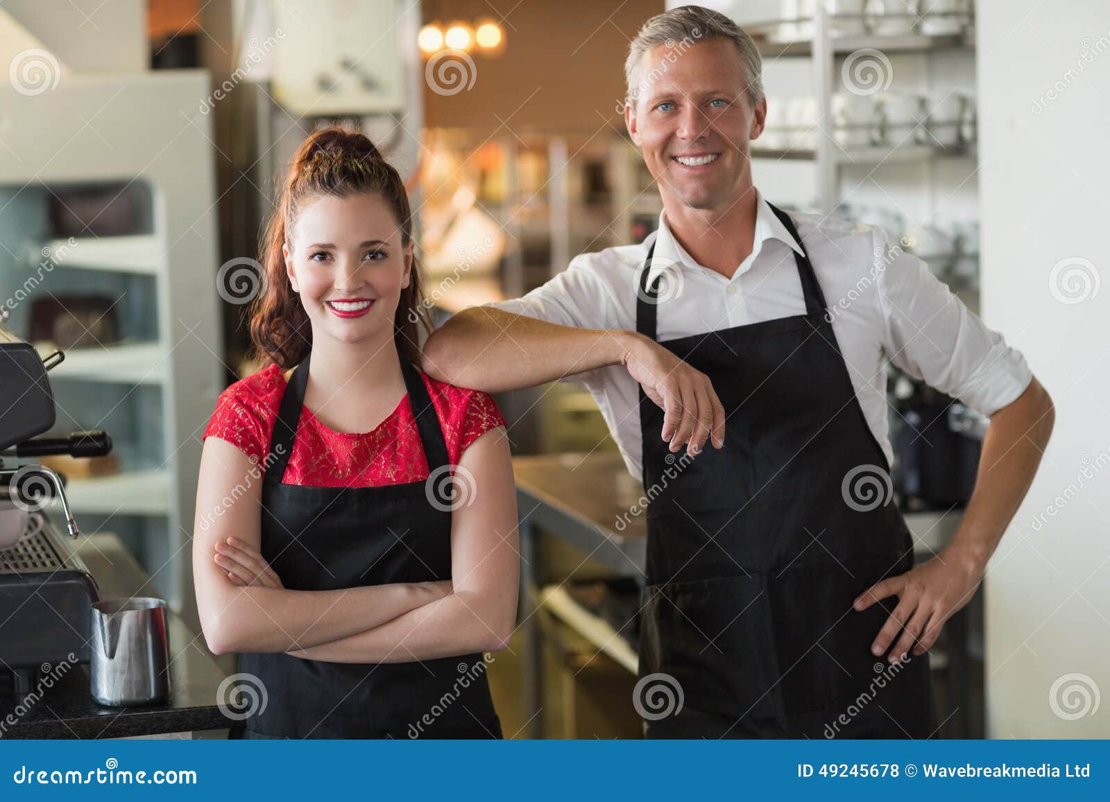Servers Smiling at the Camera Stock Photo - Image of caucasian, crossed ...