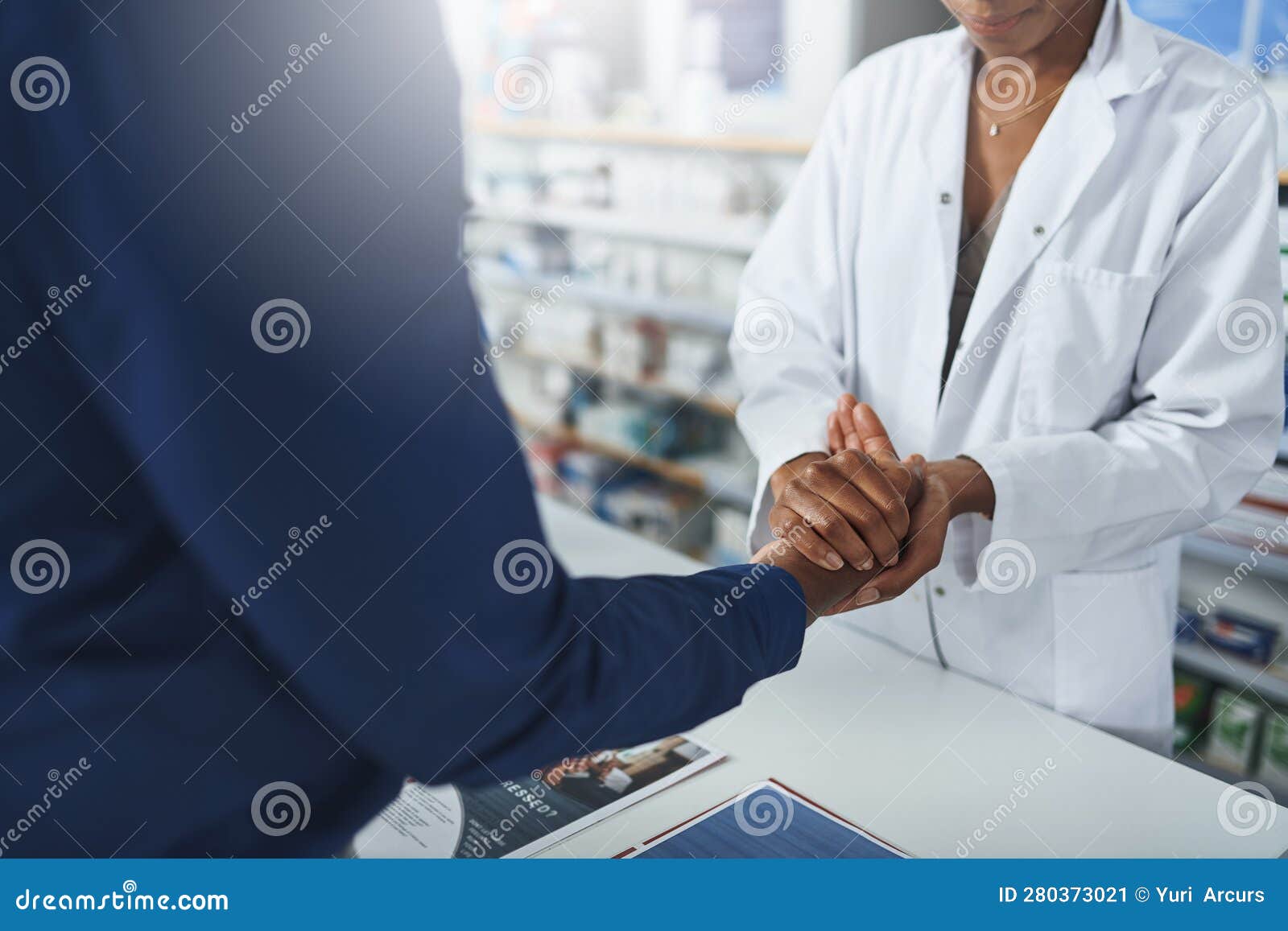 Service with Compassion. a Pharmacist Compassionately Holding a ...