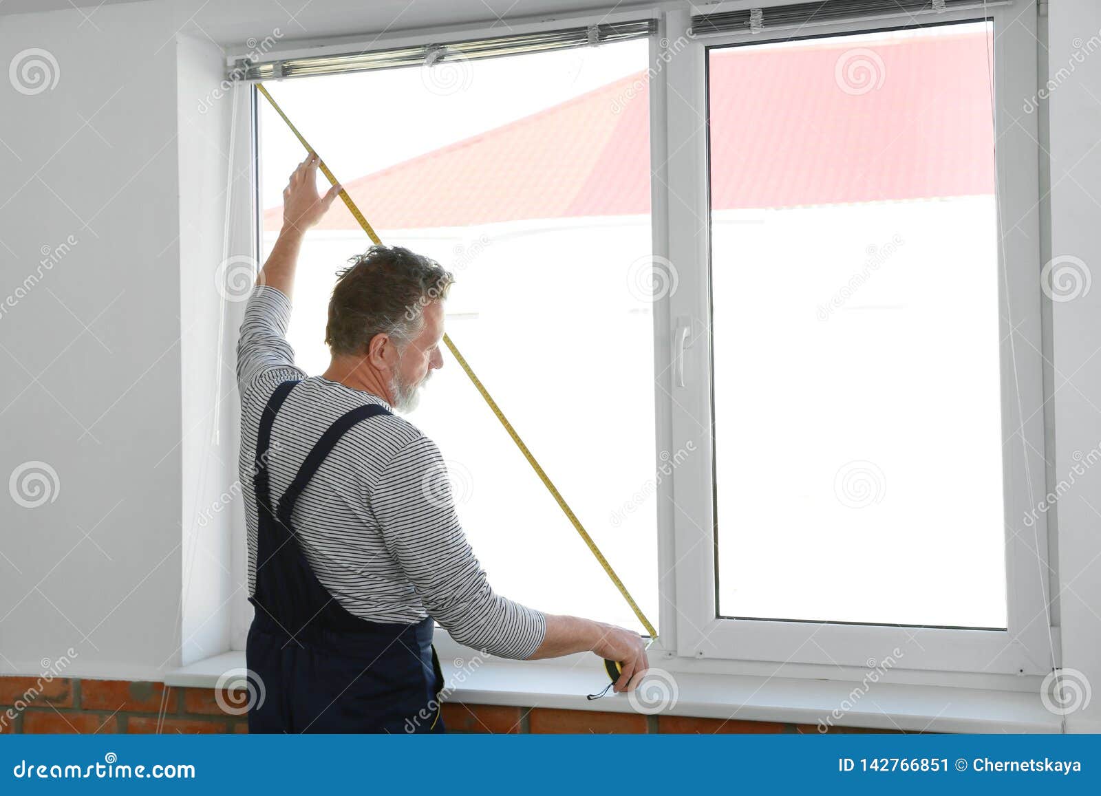 Service Man Measuring Window for Installation Stock Image - Image of ...