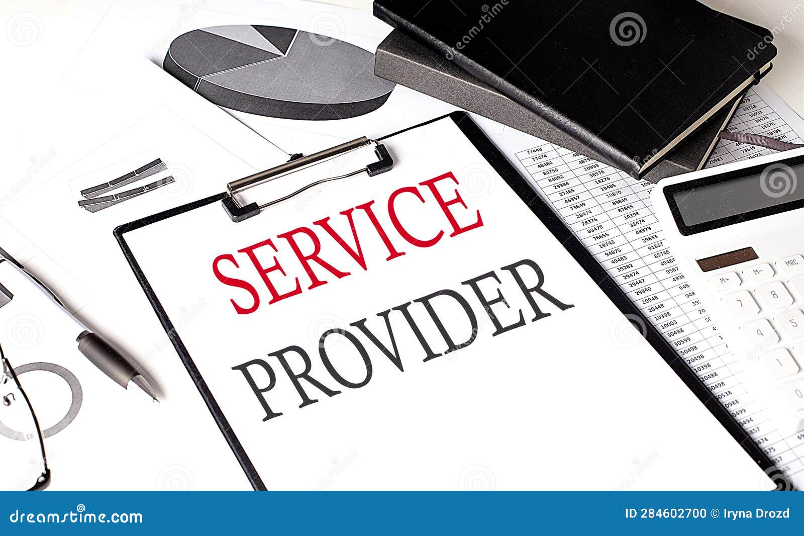 SERVICE PROVIDER Text on Paper Clipboard with Chart and Notebook on ...