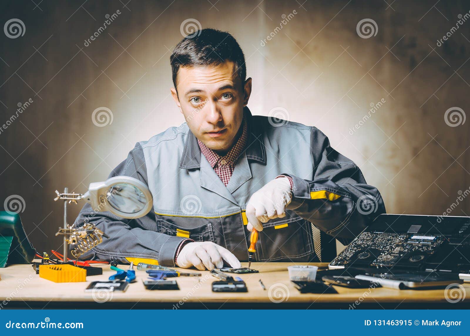 Service repair electronics stock image. Image of person - 131463915