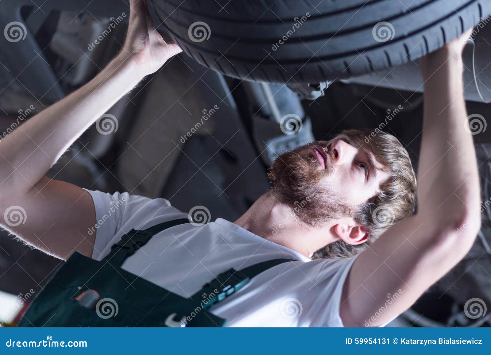 Service Station Worker Checking Tire Stock Image - Image of talking ...